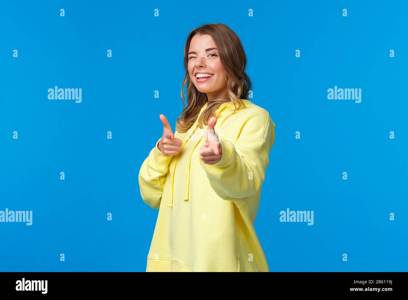 Cheerful cheeky woman yellow background hi-res stock photography and ...