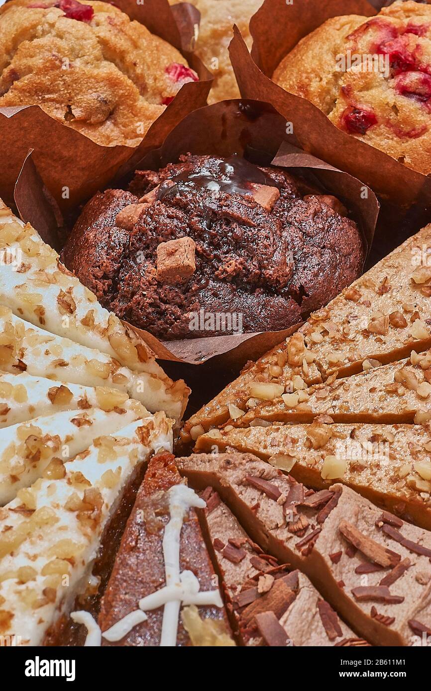 Chocolate cake slices and muffin Stock Photo - Alamy