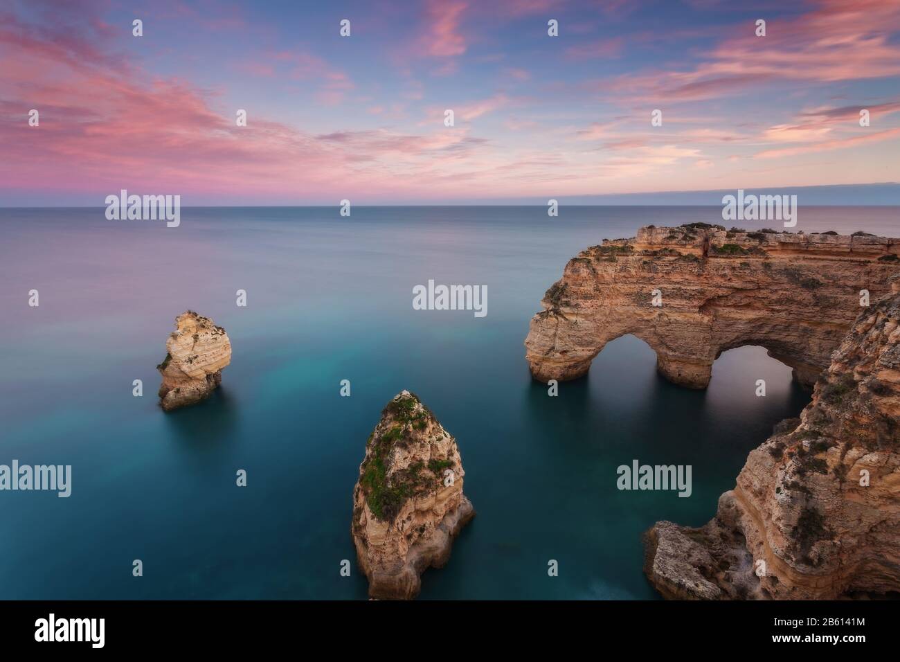 Sunset on the beach, Portugal. Arch created by nature Stock Photo - Alamy