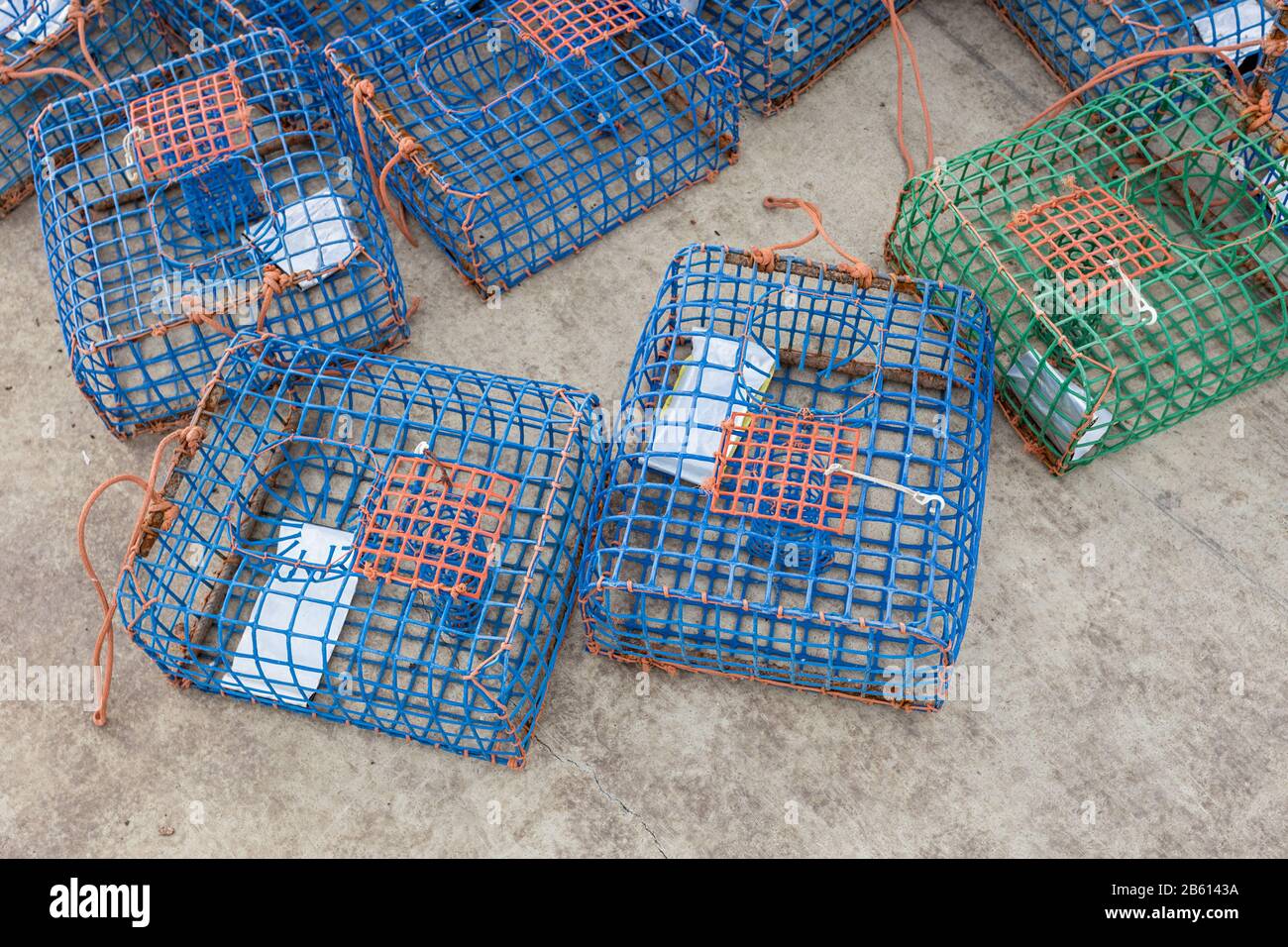 Many octopus traps stacked at the port Stock Photo - Alamy