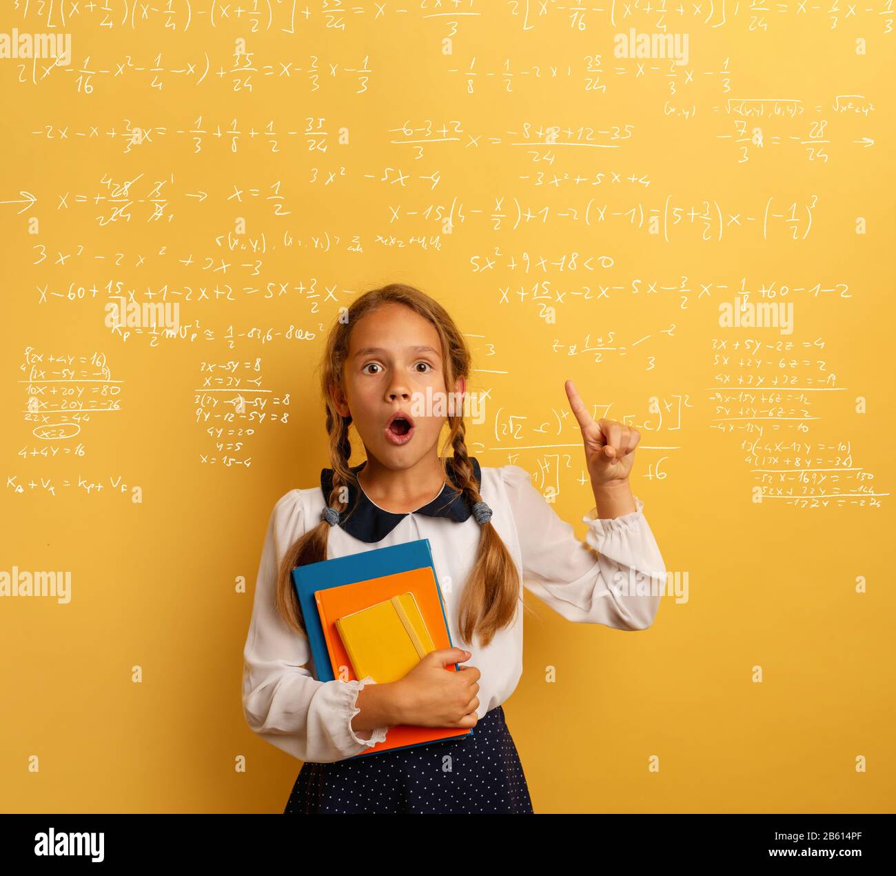 Young student is with shocked expression and indicates a complex ...