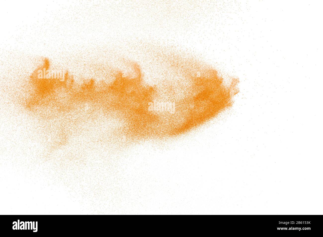 Orange powder dust particles explosion on white background.Orange dust ...