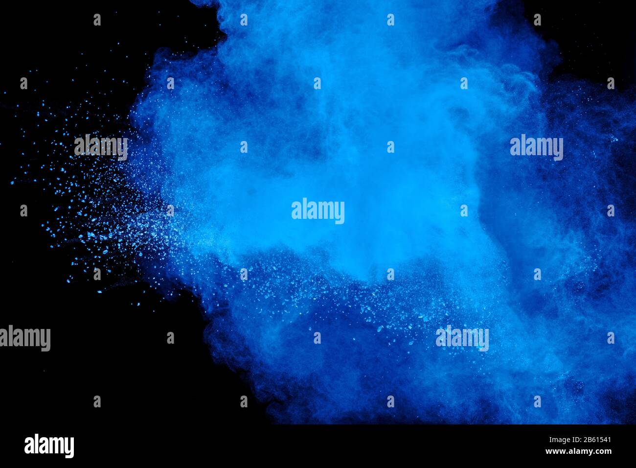 Blue color dust particles explosion cloud on black background.Color ...