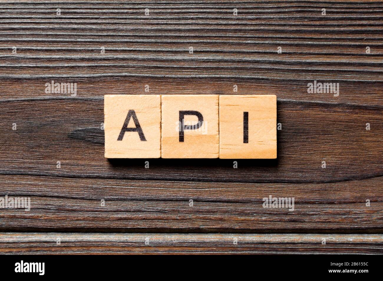 API word written on wood block. API text on wooden table for your ...