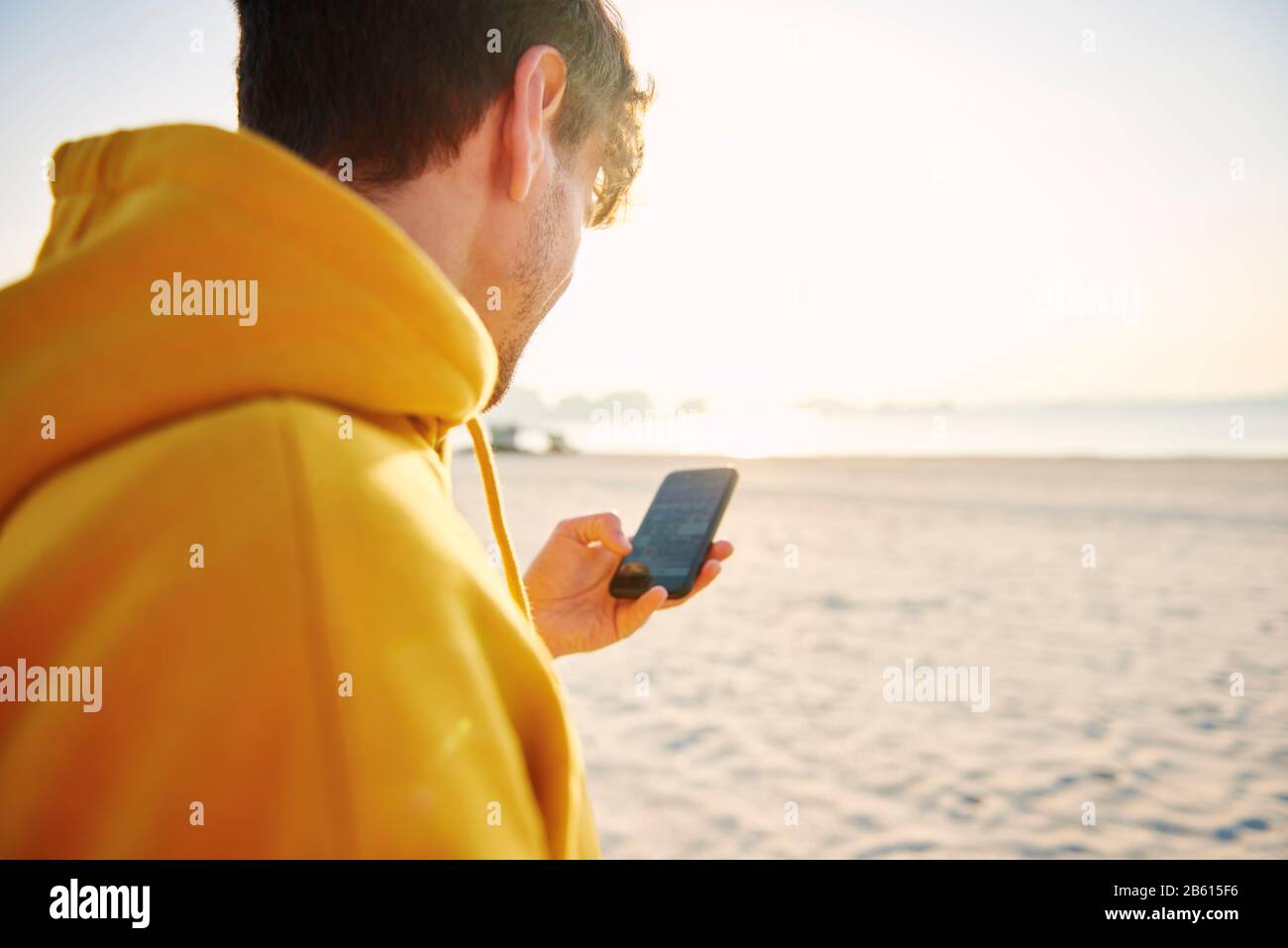 Man running outdoors using smart hi-res stock photography and images ...