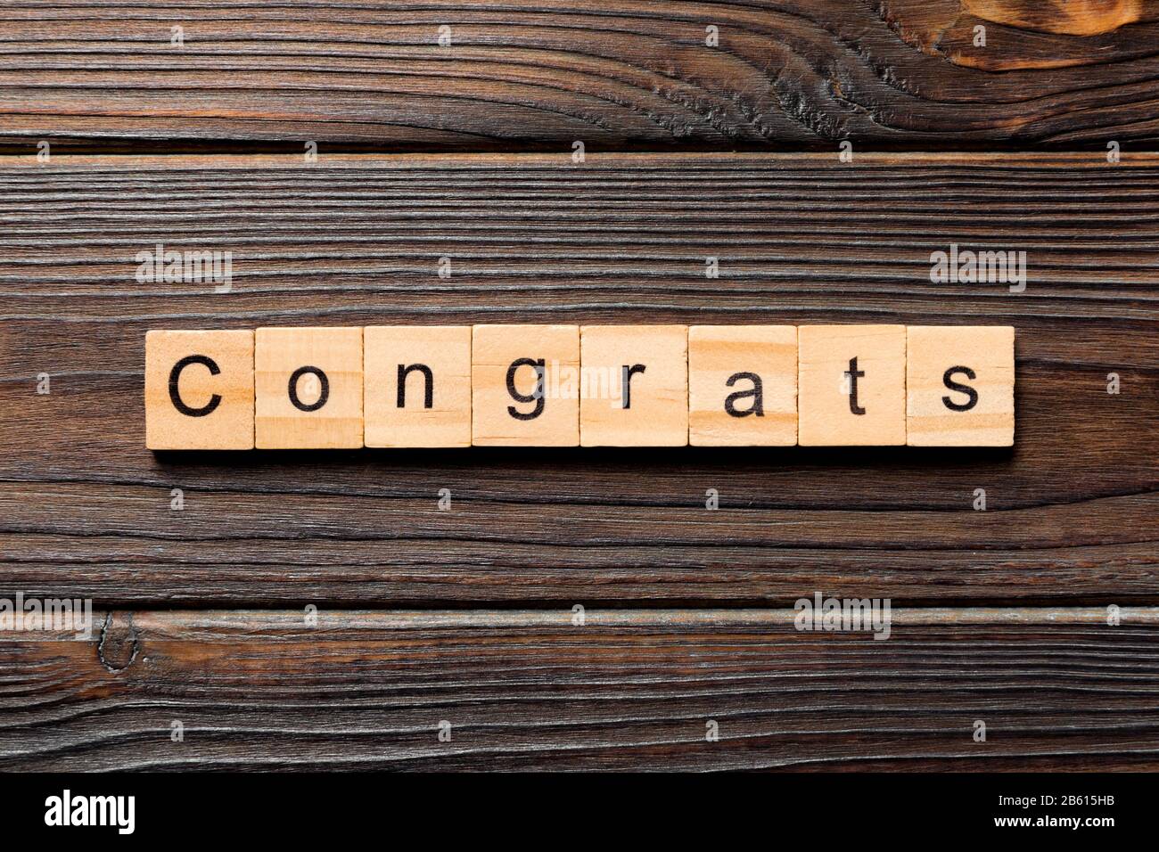 Congrats word written on wood block. Congrats text on wooden table for ...