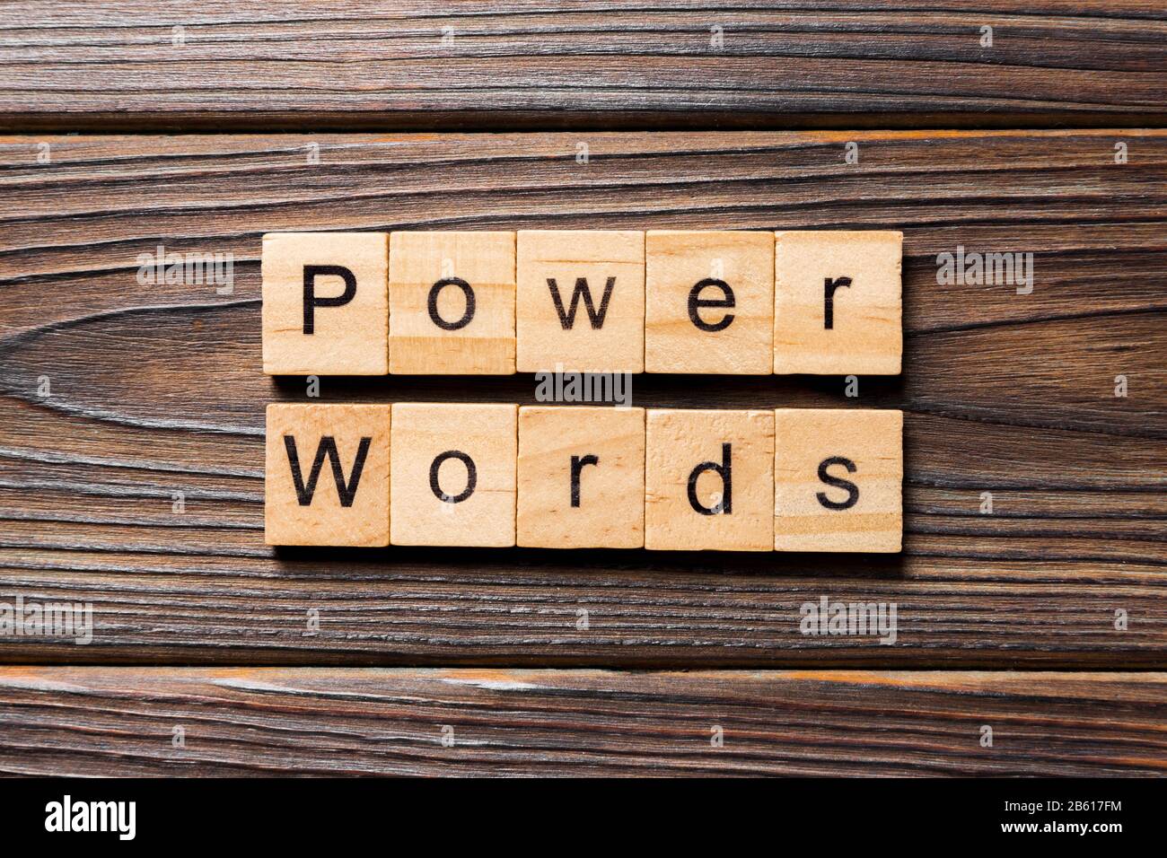 POWER WORDS word written on wood block. POWER WORDS text on table ...