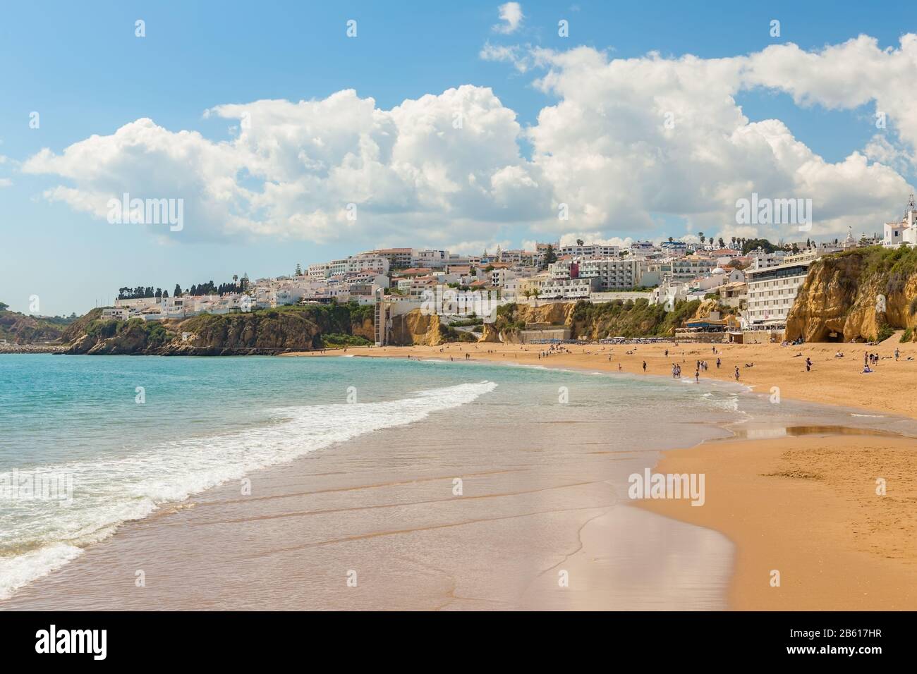 Waves on the beach in Albufeira fishermen. Portuguese tourist town ...