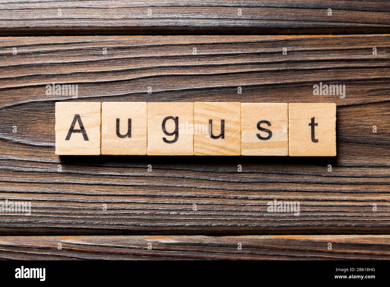 August word written on wood block. August text on wooden table for your ...