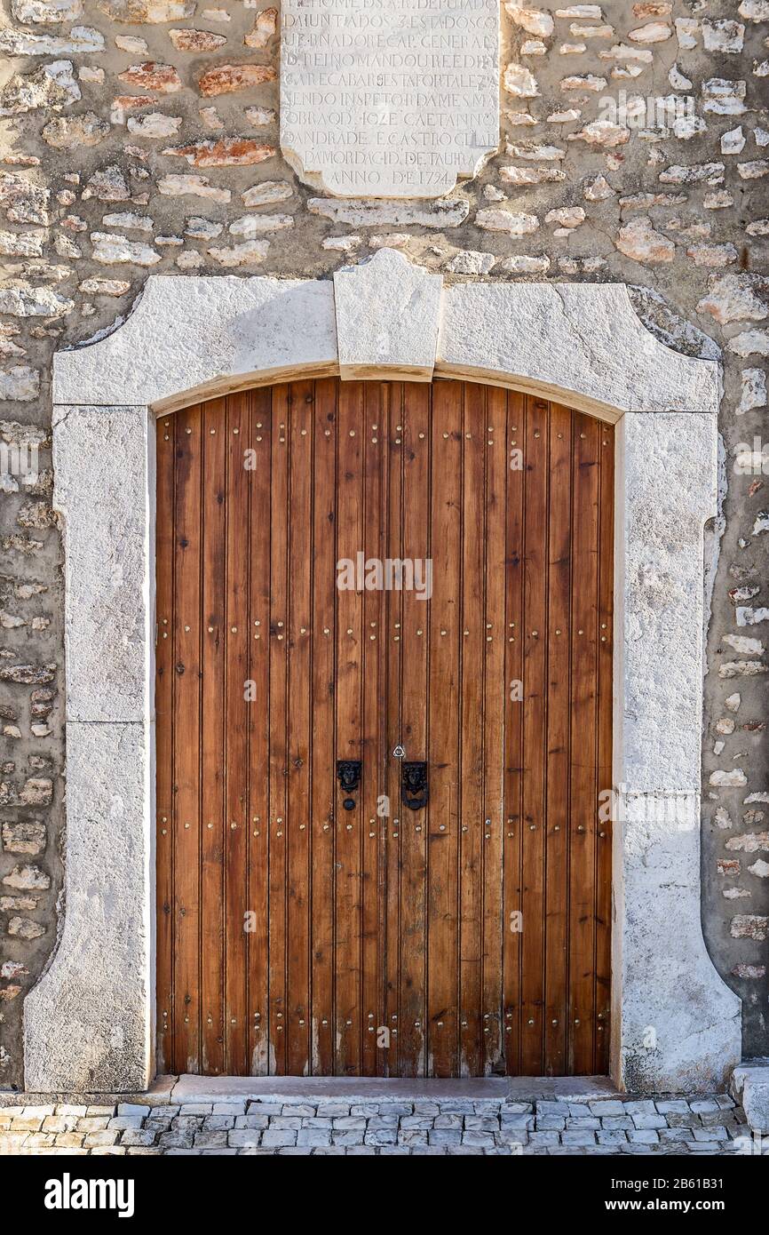 Old decorative door in a stone wall. Traditionally Portuguese Stock ...
