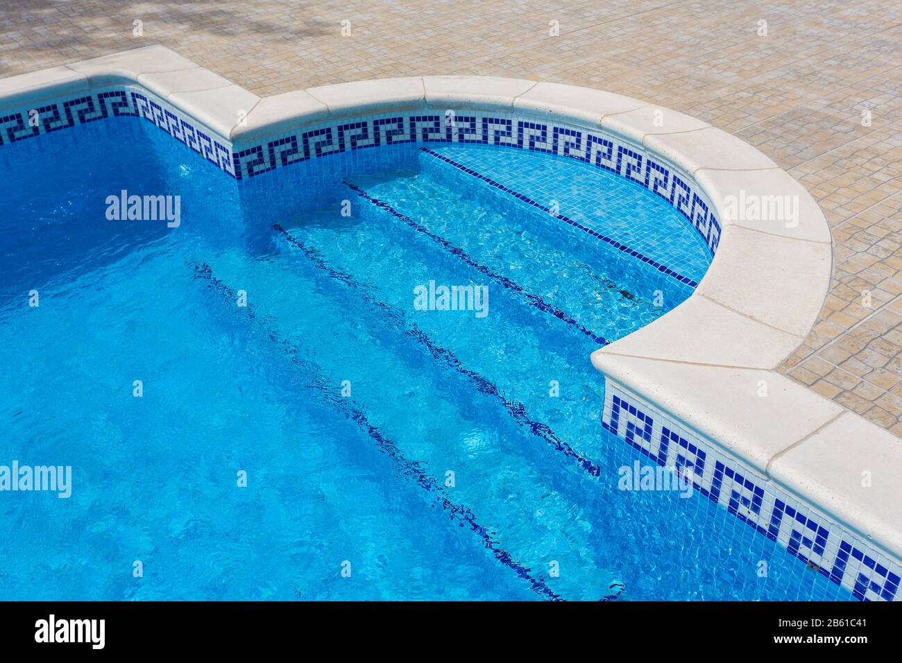 Entrance to the pool of marble, tiles, with clear water. In the summer ...