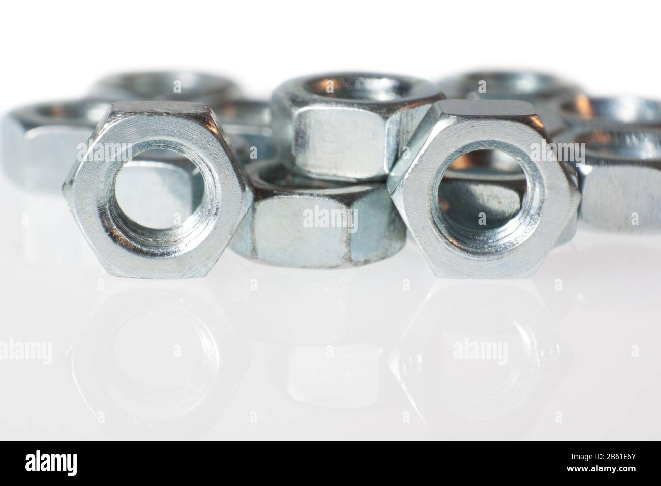 Group chrome nuts on white background Stock Photo - Alamy