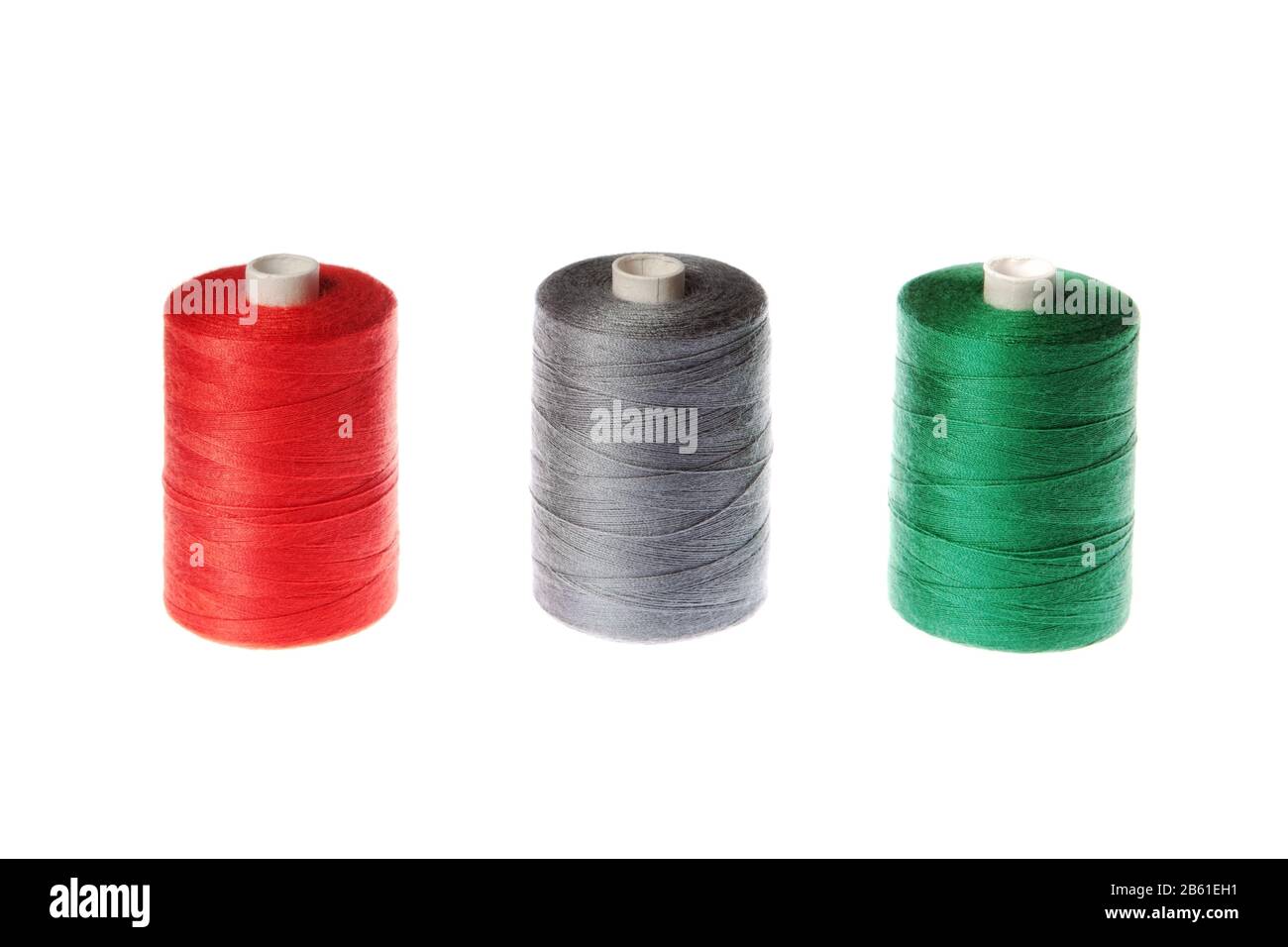spool of thread. green, blue, red Stock Photo - Alamy