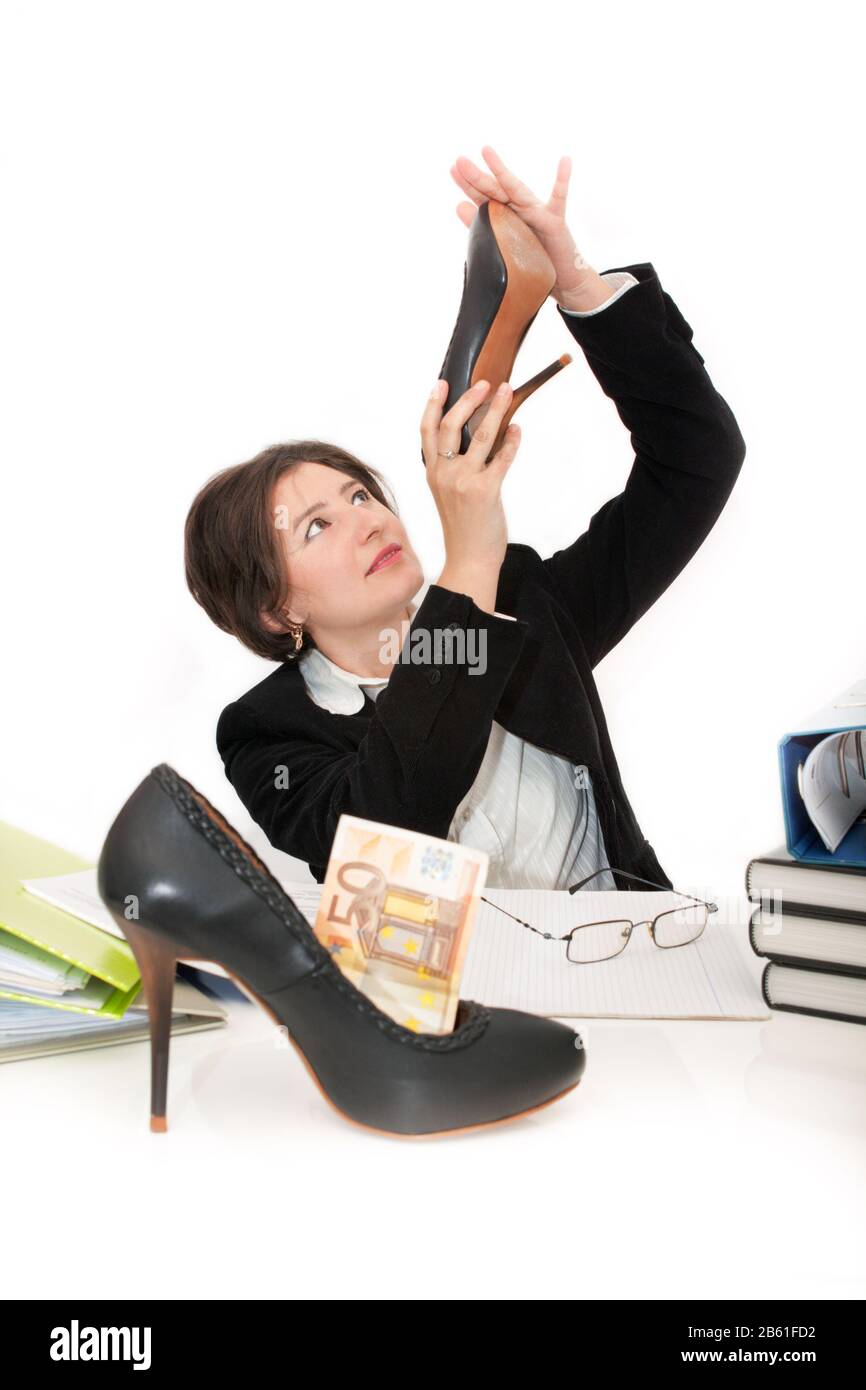 beautiful business woman looking at her shoe Stock Photo - Alamy