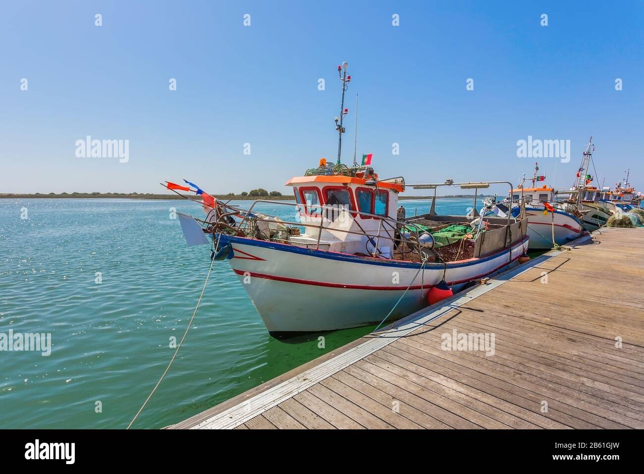 Portuguese fishing boat on the pier. With traditional colors Stock ...