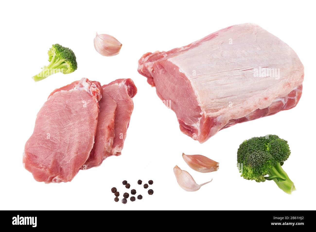 Preparation of raw meat for grilling spices. On a white background ...