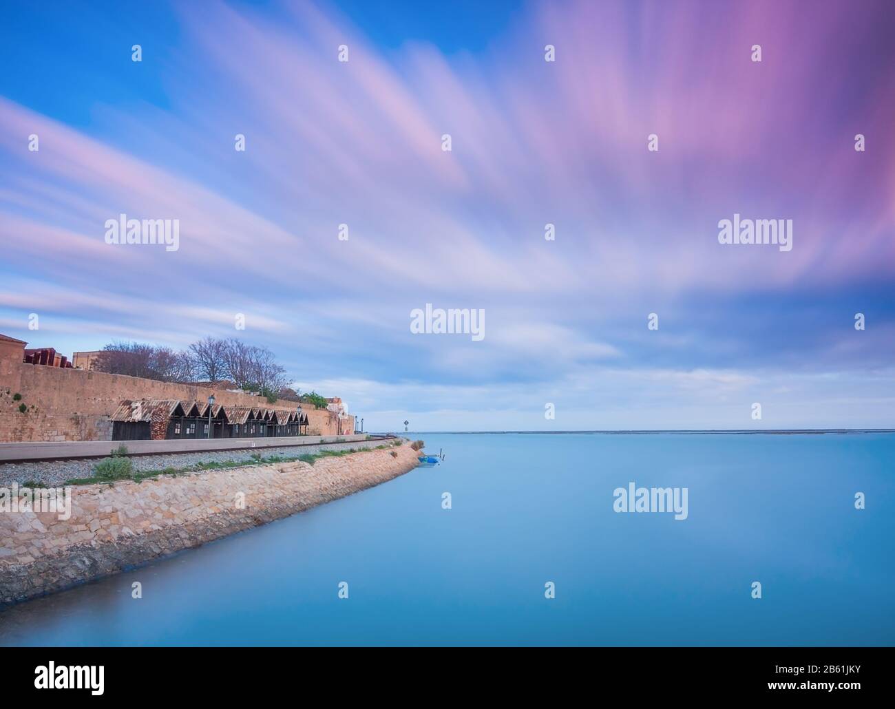 Landscape of the old town of Faro in Portugal. With moving sky Stock ...