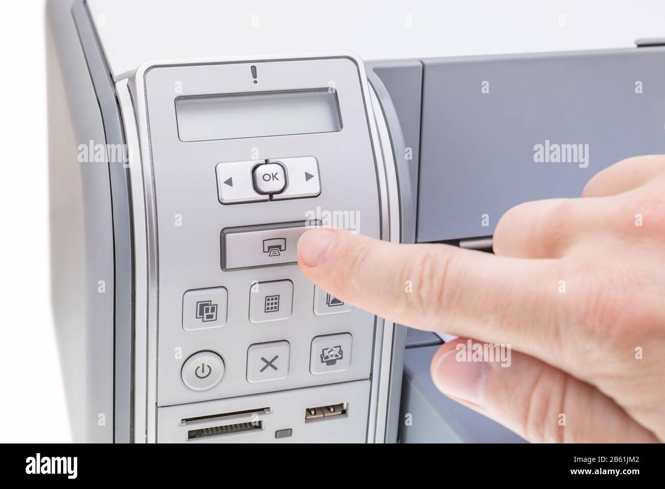 Office worker presses the button the printer. Close-up Stock Photo - Alamy
