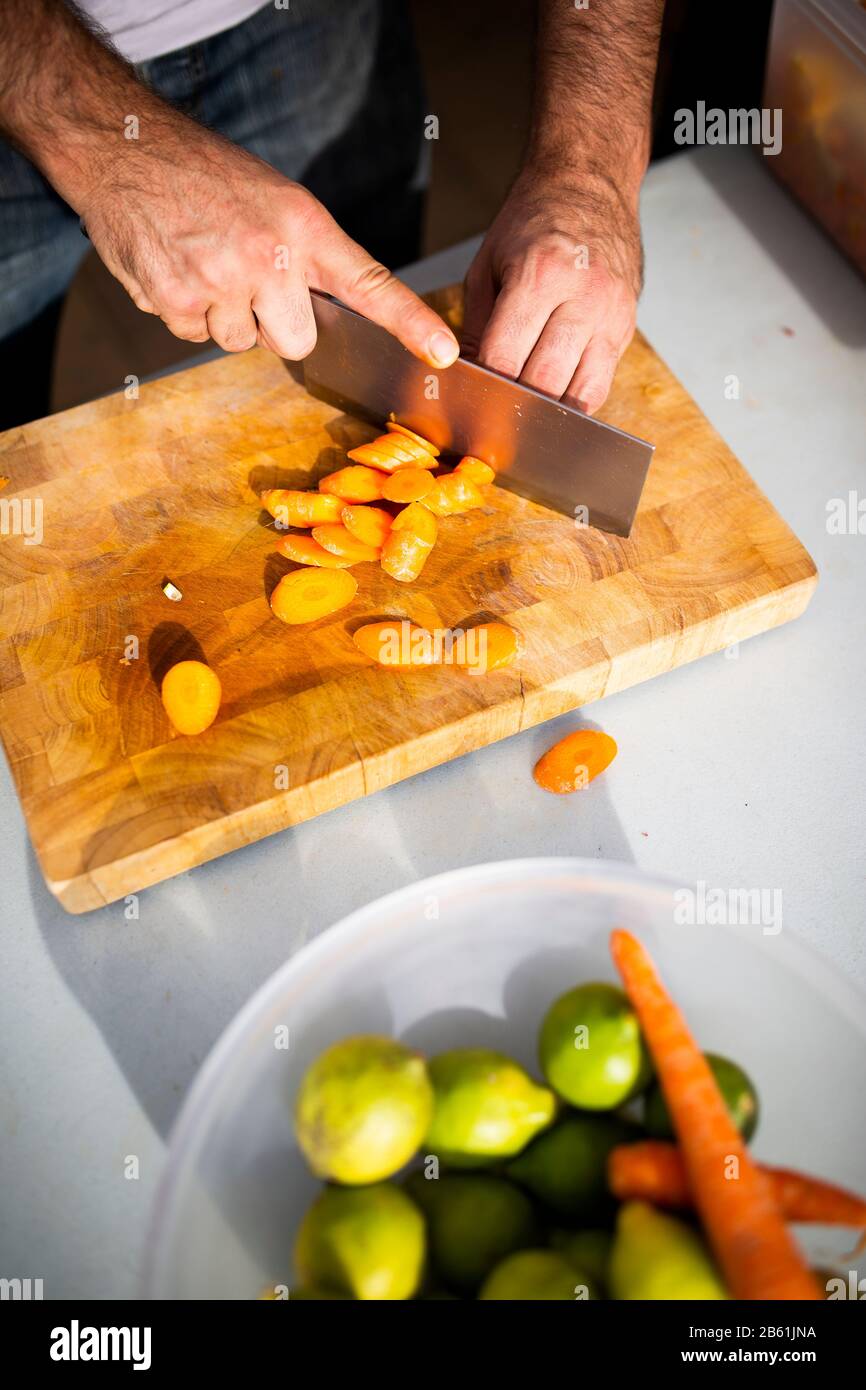 Hands Chopping Carrot High Resolution Stock Photography and Images - Alamy