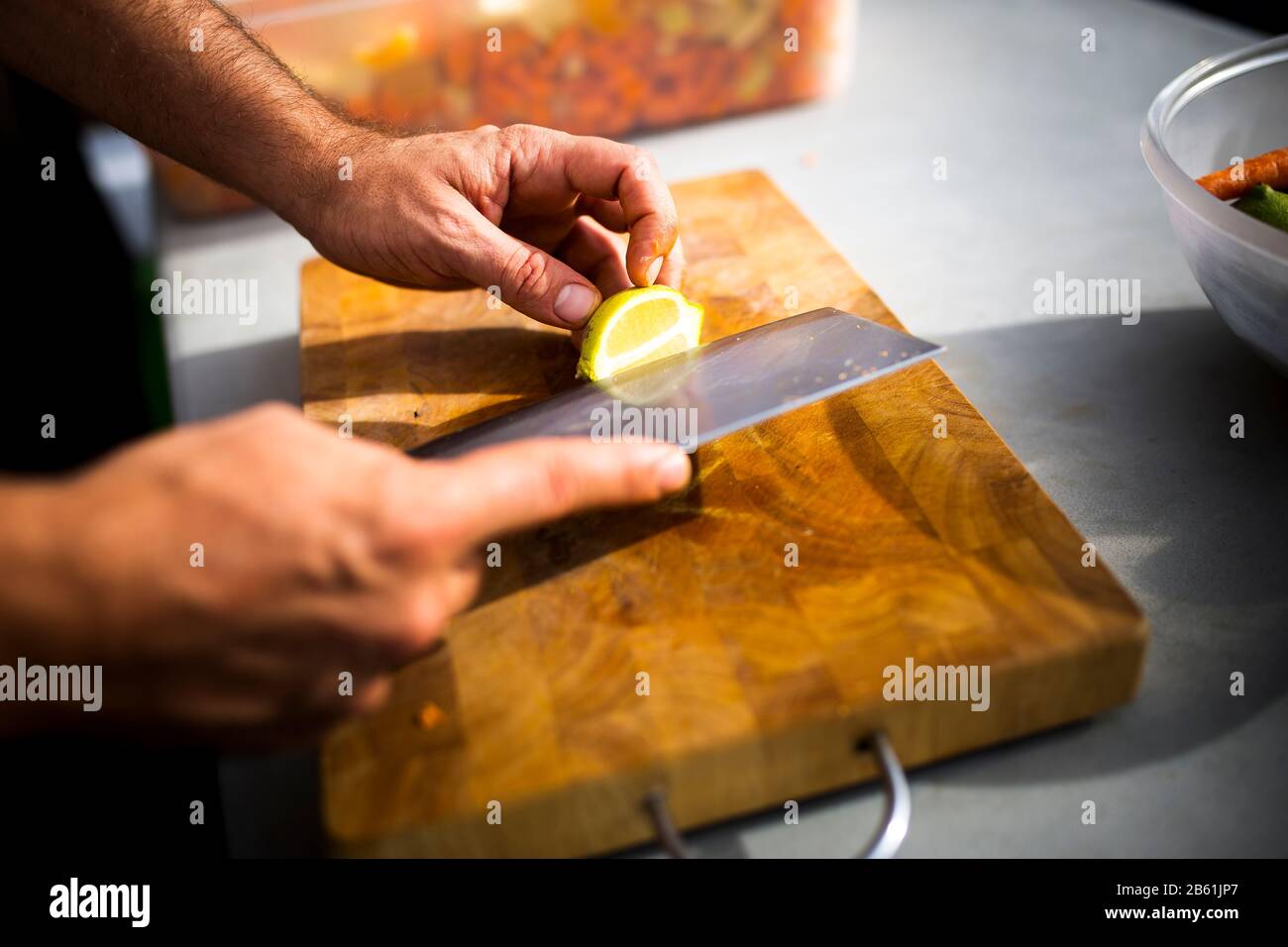 Hands Chopping Carrot High Resolution Stock Photography and Images - Alamy