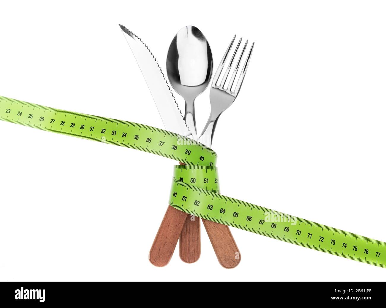 Fork knife and spoon in a tape meter. To measure the diet Stock Photo ...