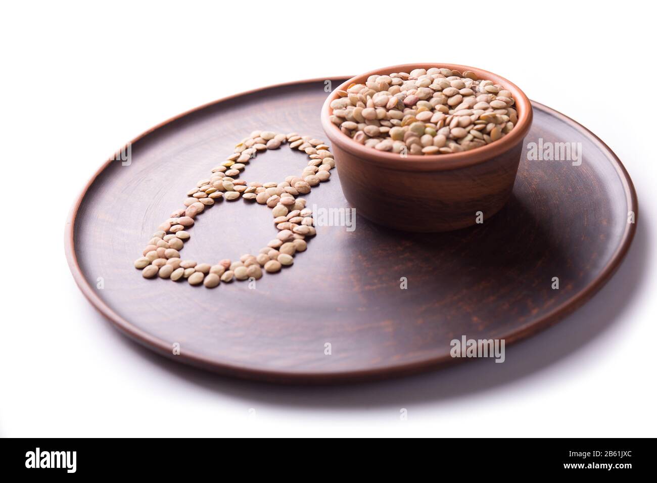 Plate of lentils with vitamin B on a white background Stock Photo - Alamy