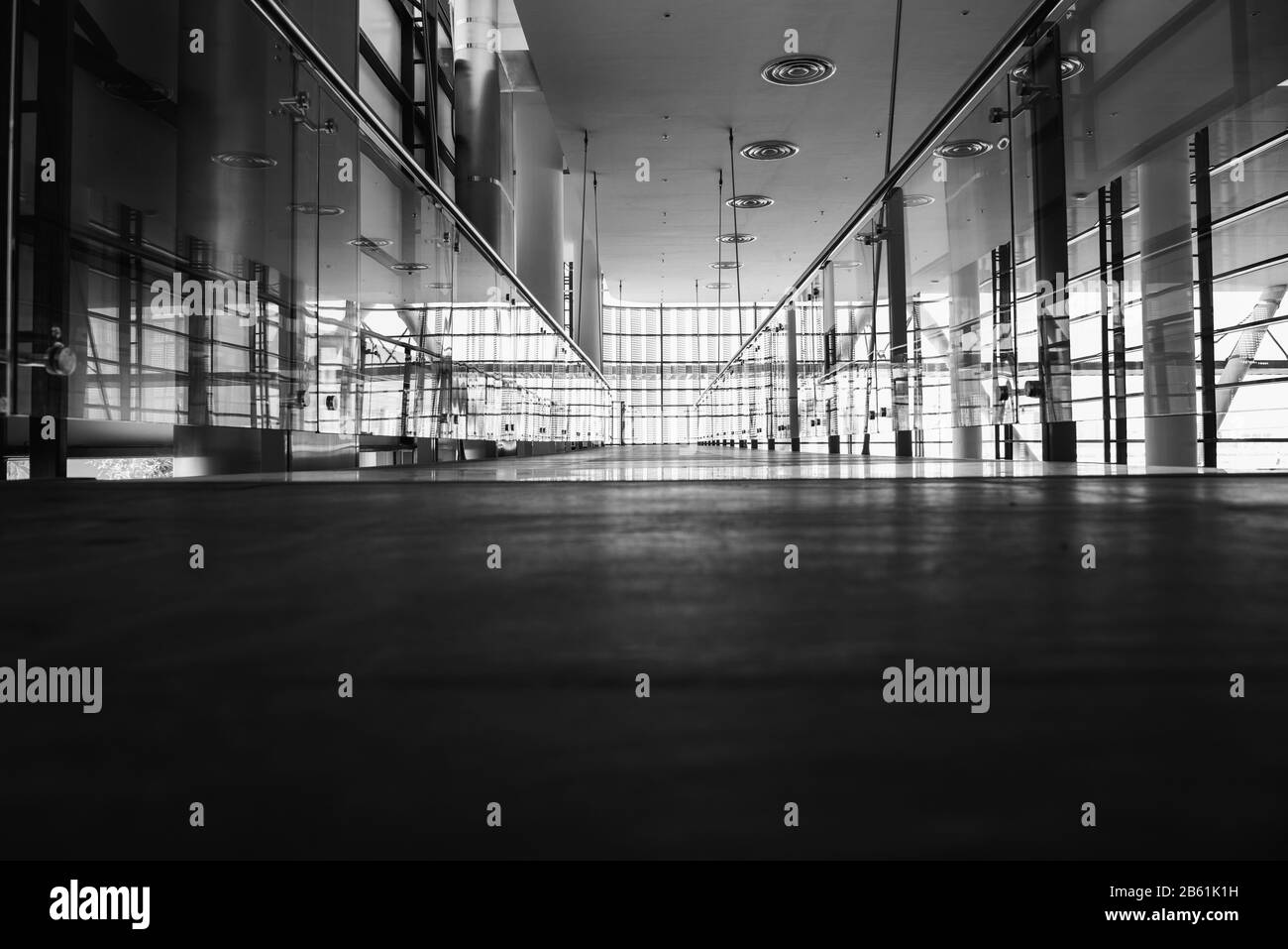 along the gangway of a modern futuristic building Stock Photo - Alamy
