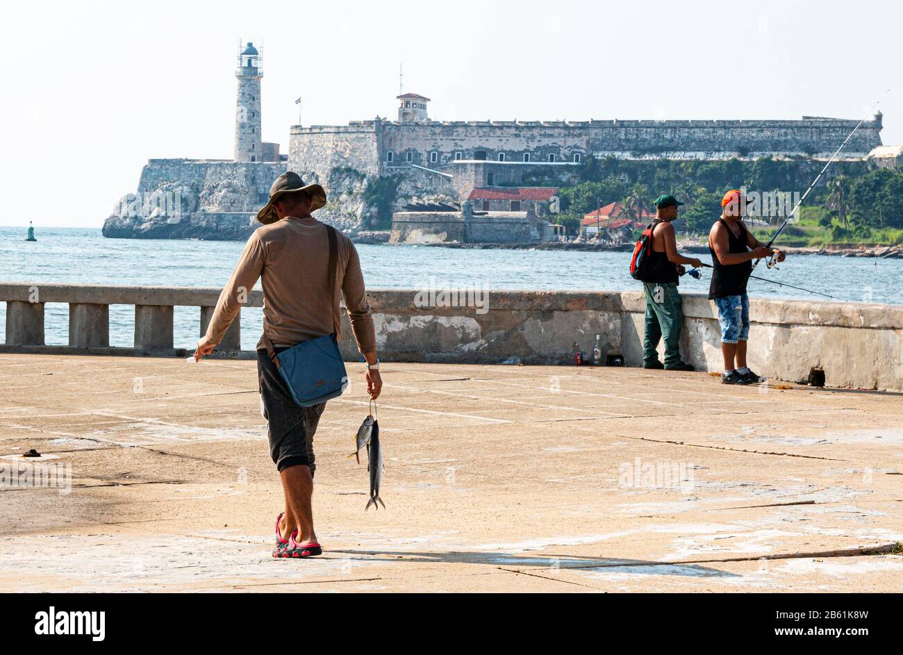 Havana, Cuba - 25 July 2018: Fisherman in Havana Cuba walking on the ...