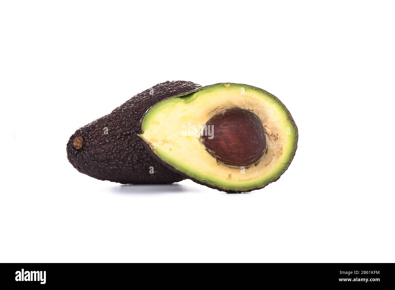 Two Haas Avocado Fruits Isolated Over White Background. Slice avocado ...