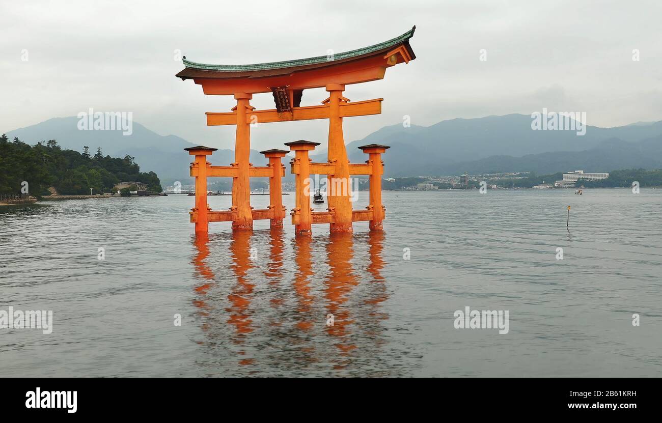 Tori gate at sea on Miyajima, Hiroshima Stock Photo - Alamy