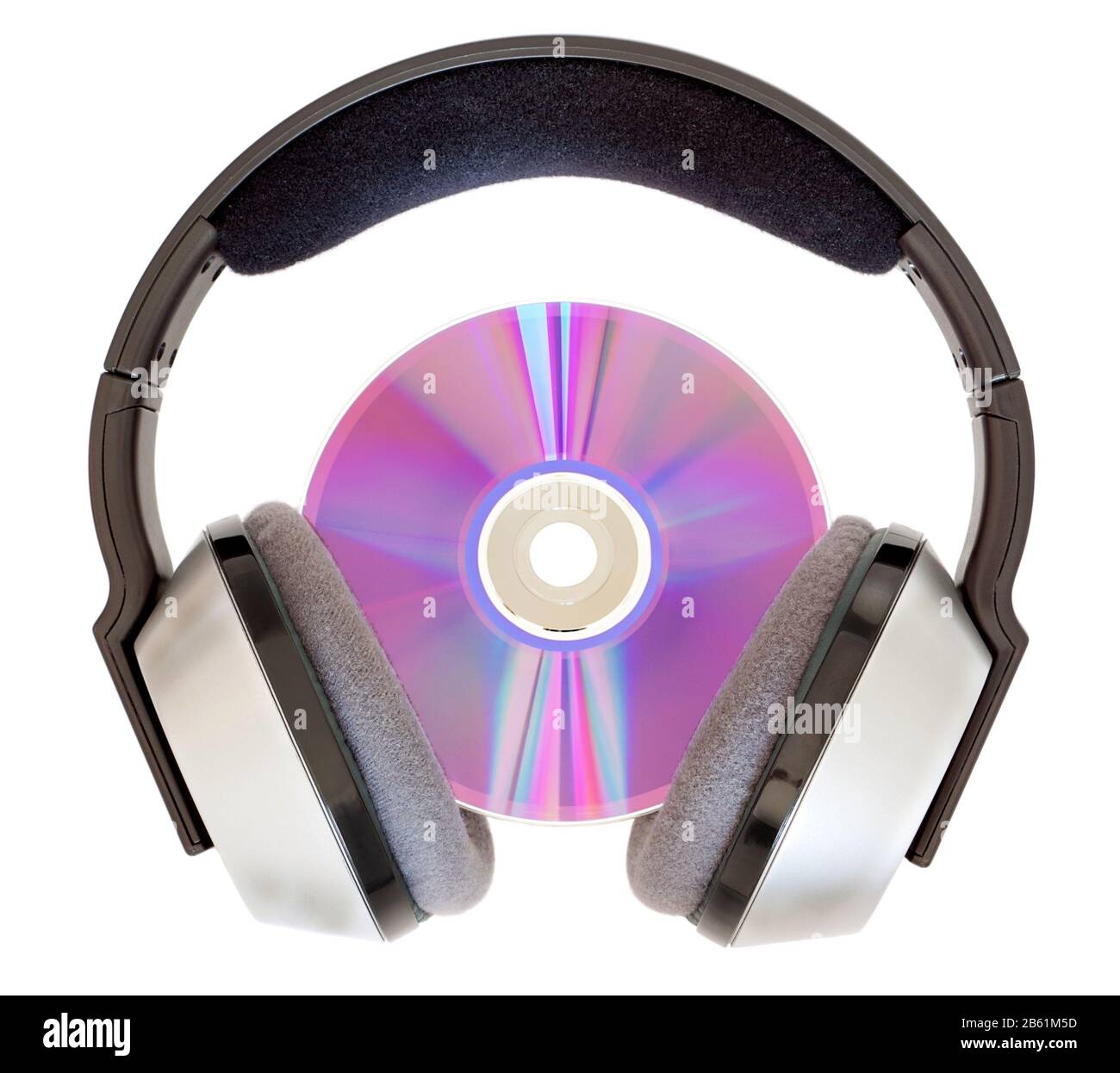 Wireless headphones and a CD for listening to music. On a white ...
