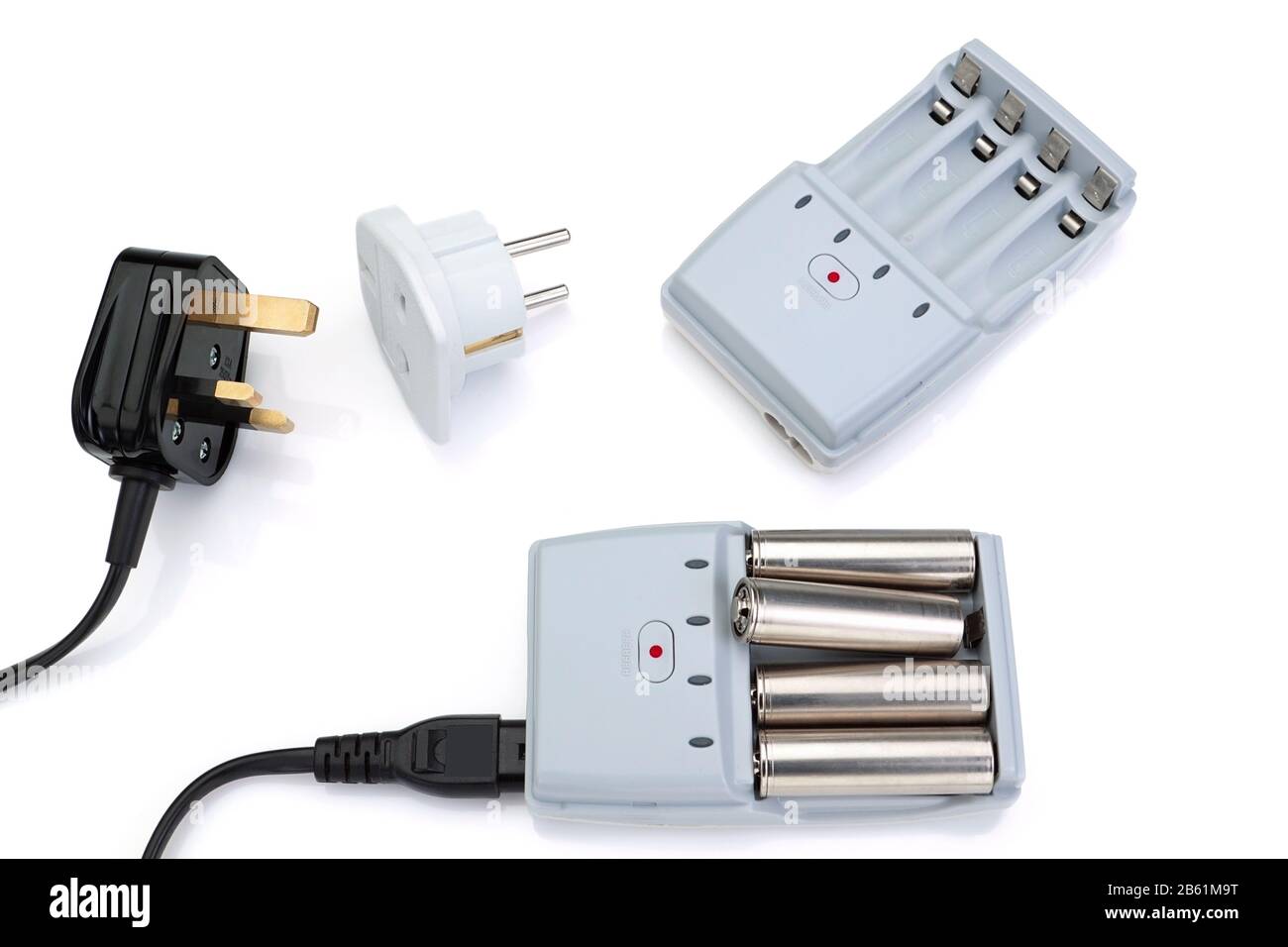 Plug adapter, charger and battery. On a white background Stock Photo ...