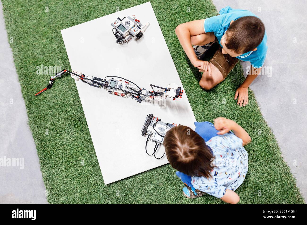 Two young boys playing with robots, educational and playing concept ...