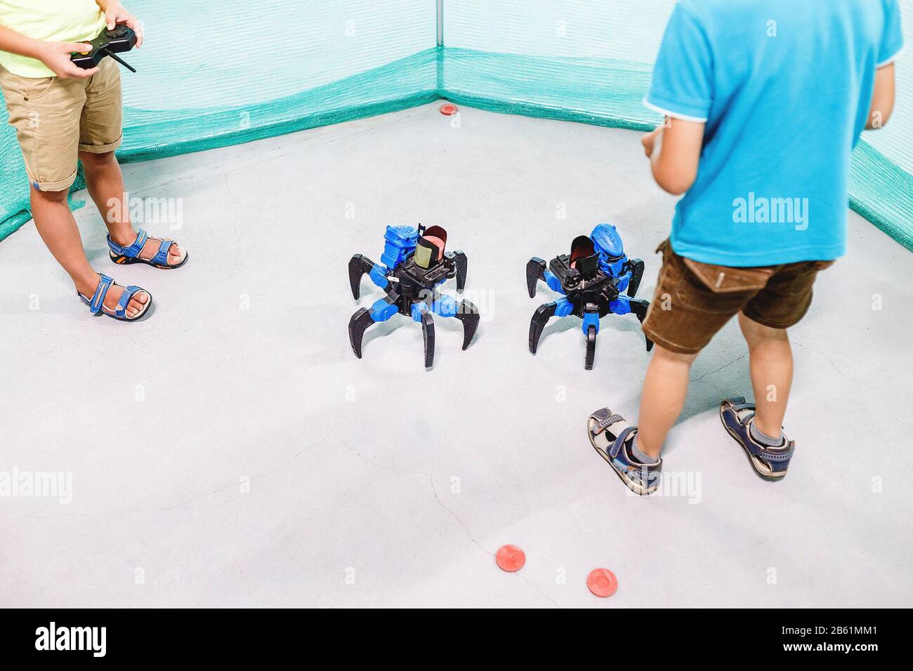 Two young boys playing with robots, educational and playing concept ...