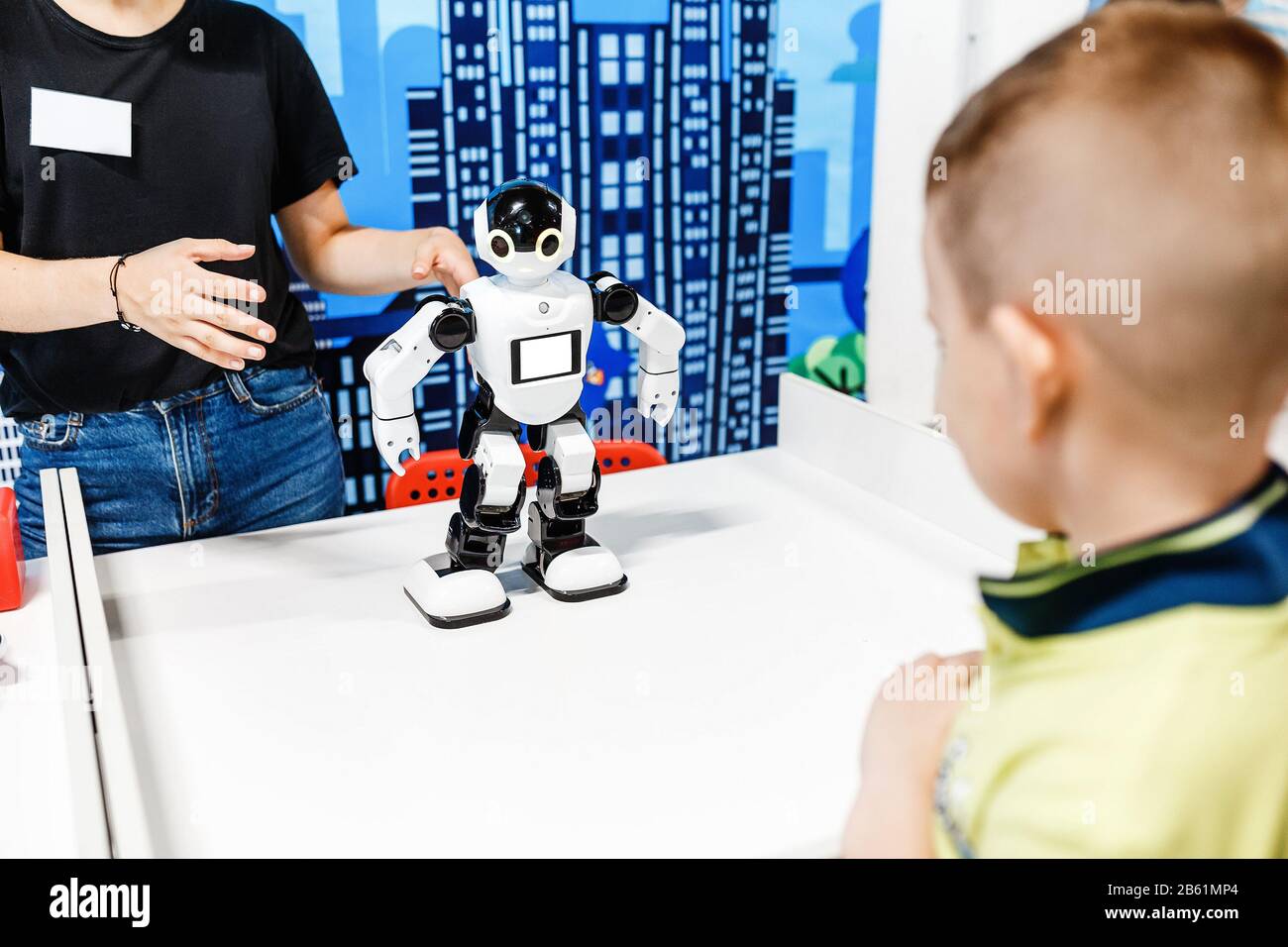 Kid looking at android dancing robot, leisure and science concept Stock ...