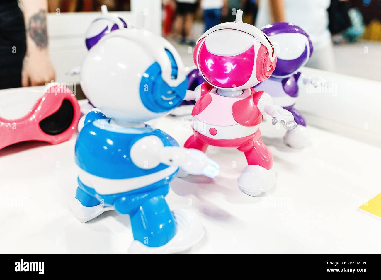 Two colorful toy Robots dancing at the exhibition Stock Photo - Alamy