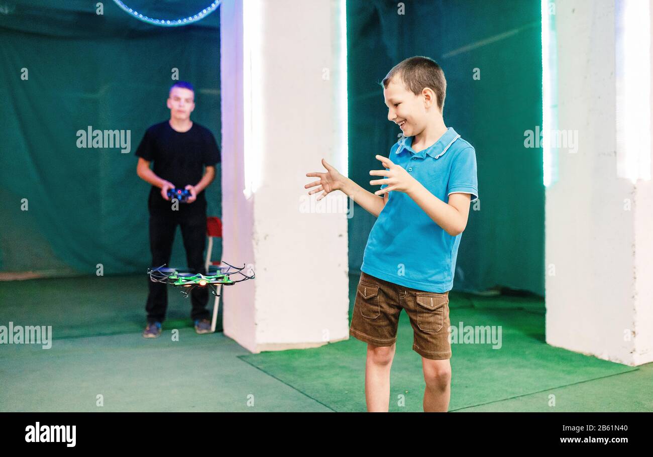 Little kid playing with drone indoors Stock Photo - Alamy