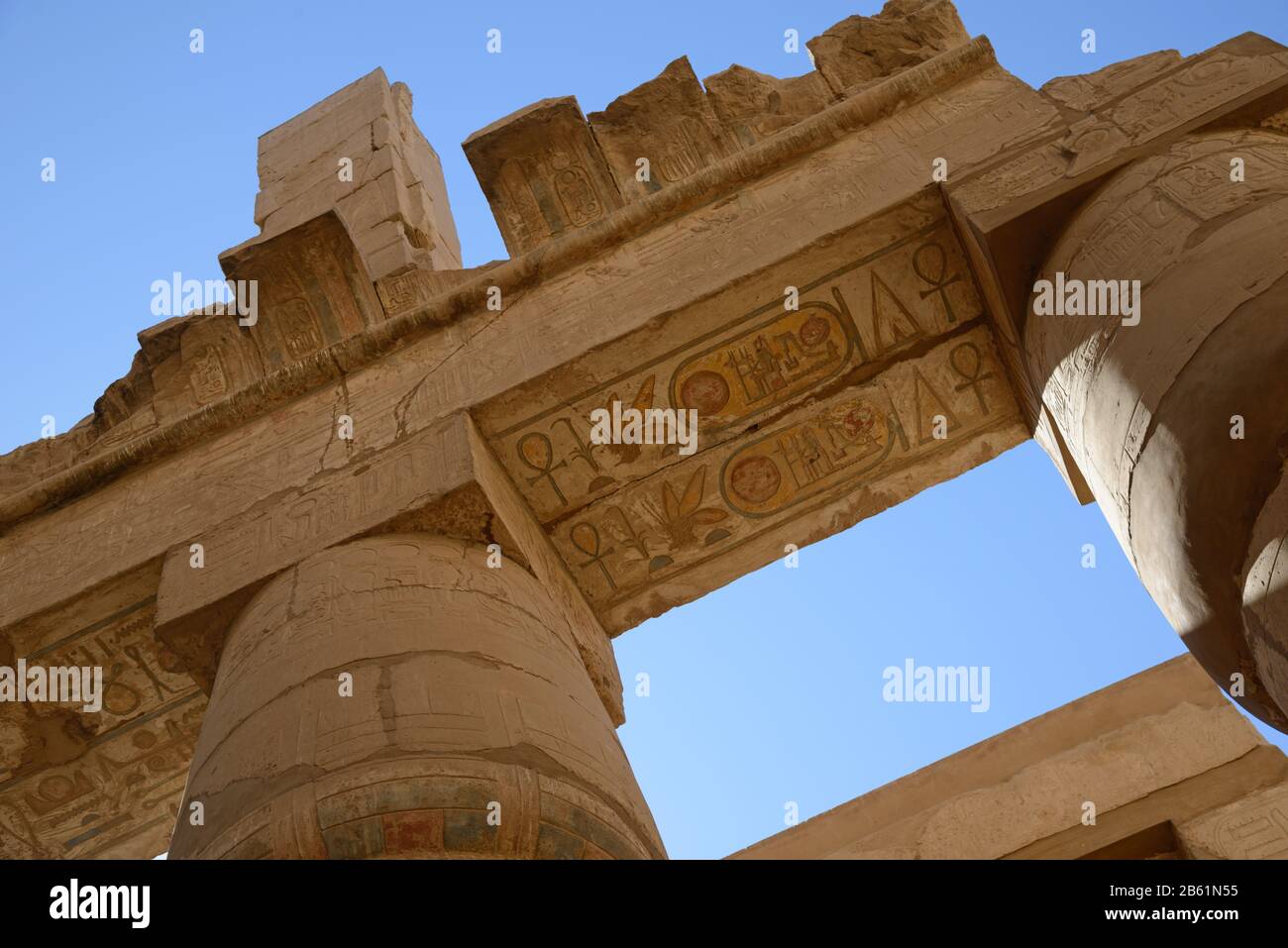 Giant columns of luxot complex against blue sky background. Egyptian ...