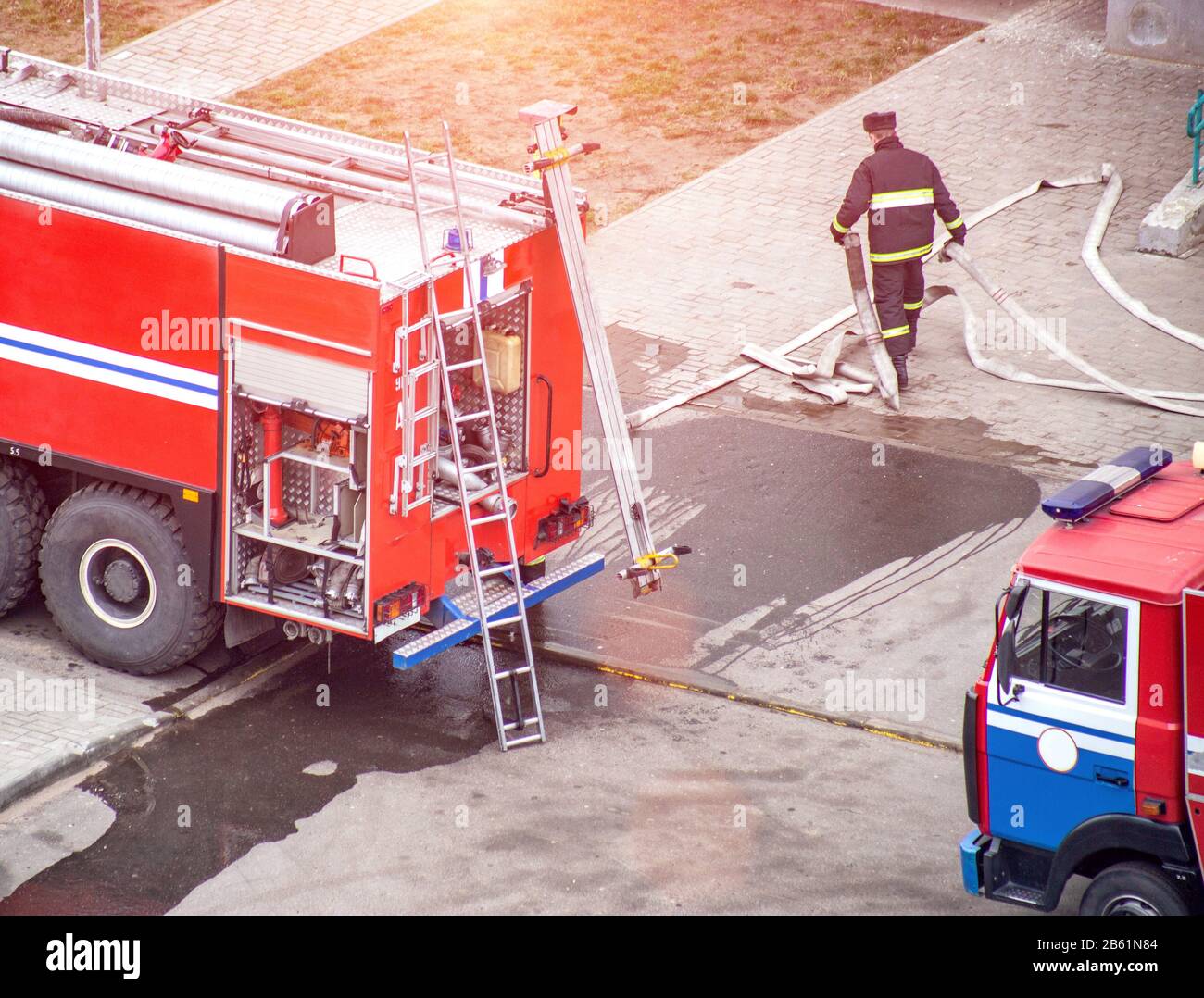 Firefighters rescue extinguish a fire in a residential building ...