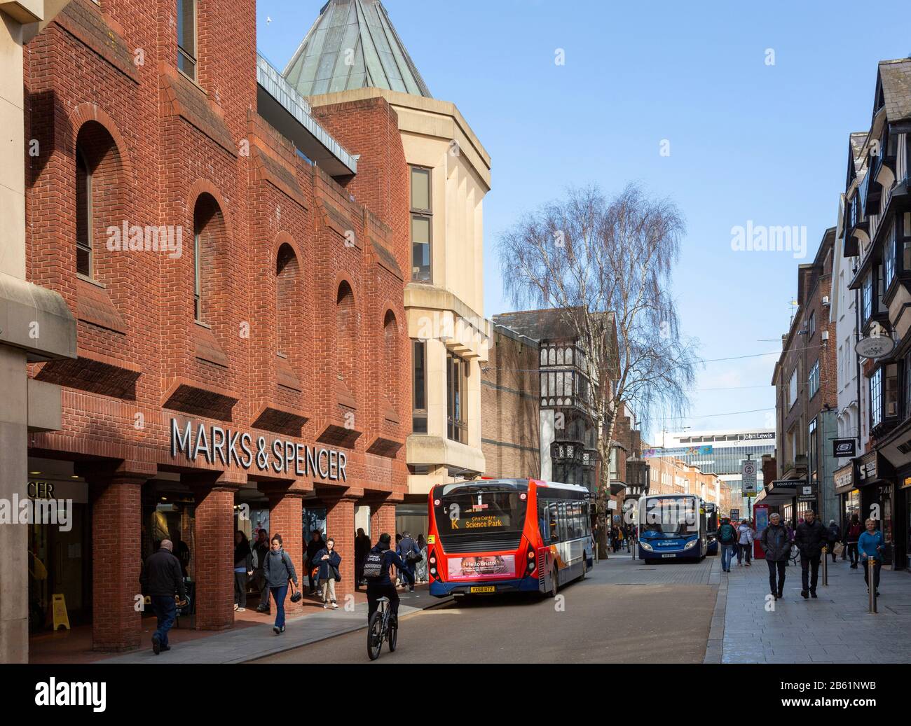 Marks and Spencer store and buses in High Street, Exeter, Devon ...