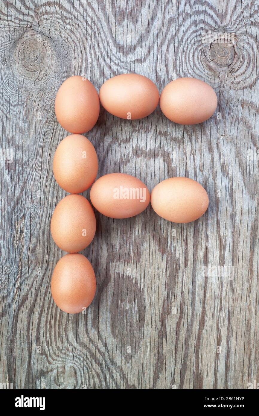 A letter f from the eggs for easter. On a wooden texture Stock Photo ...