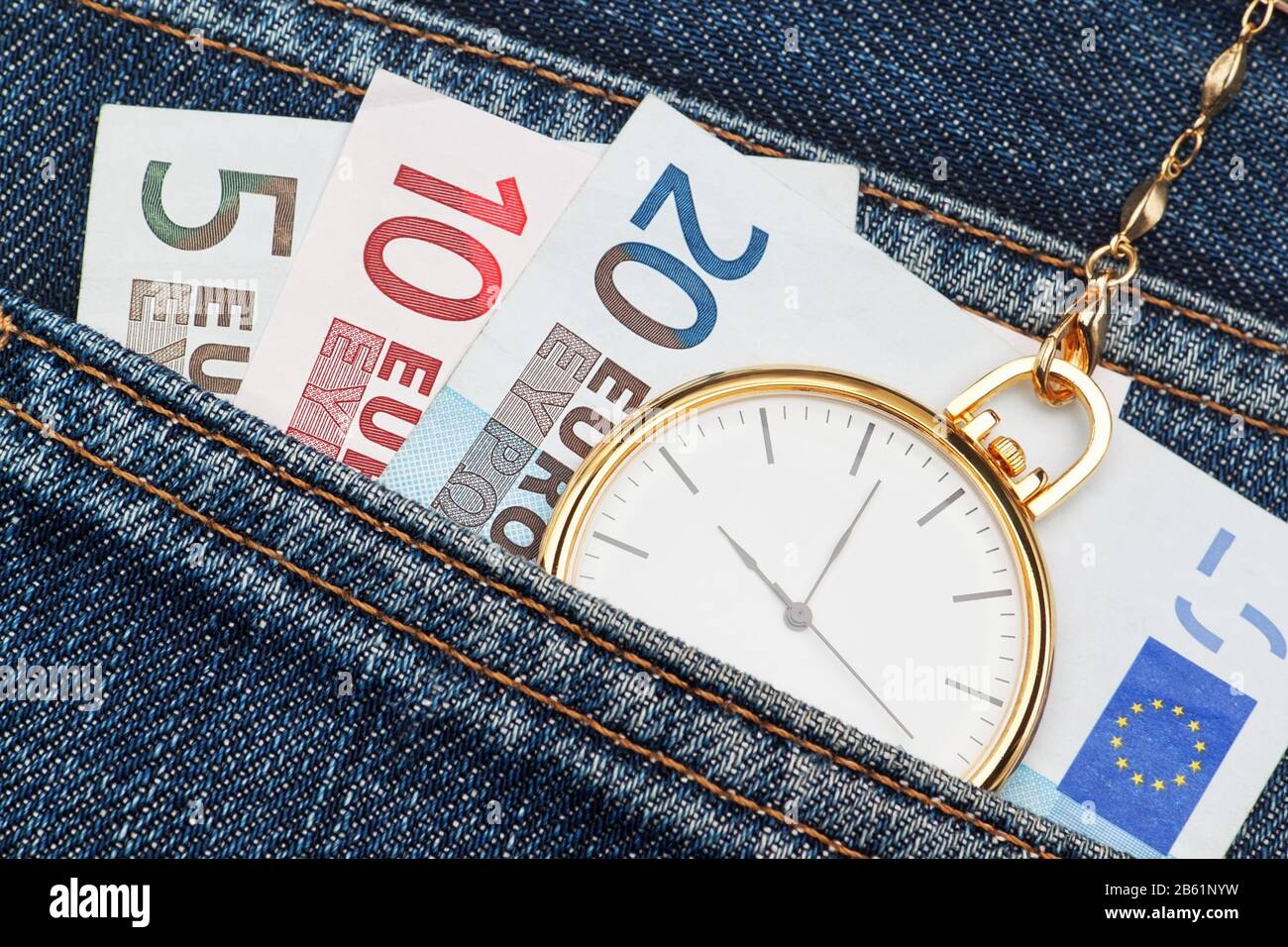 Pocket watch with chain in jeans and money euro. Close-up Stock Photo ...