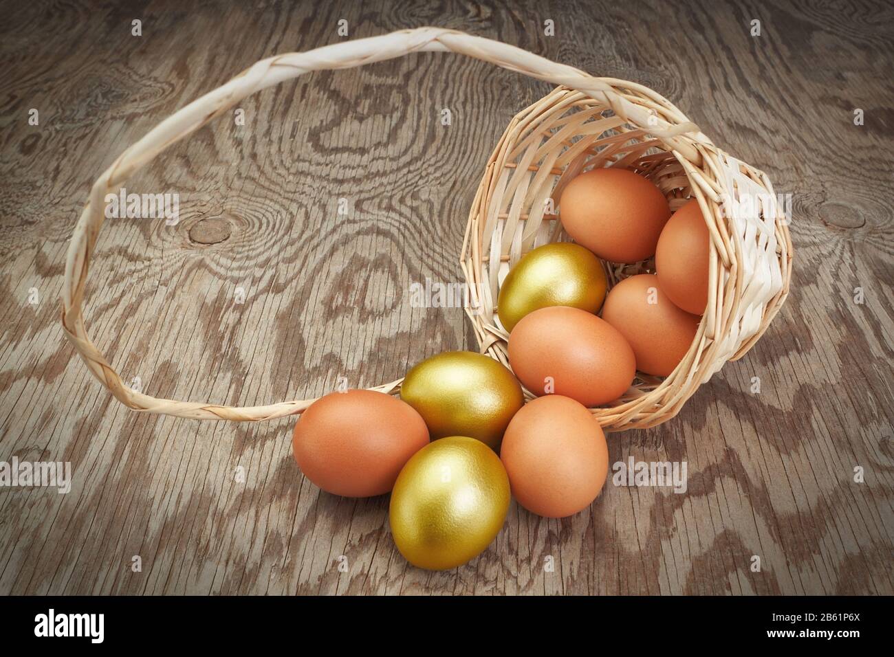 Easter eggs in an inverted basket. Group of golden eggs Stock Photo - Alamy