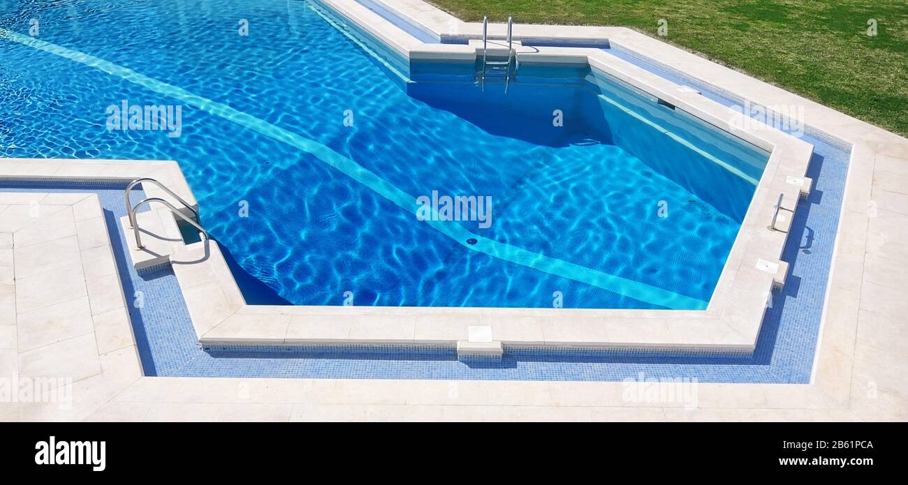 Clear blue pool in the park. Closeup Stock Photo - Alamy