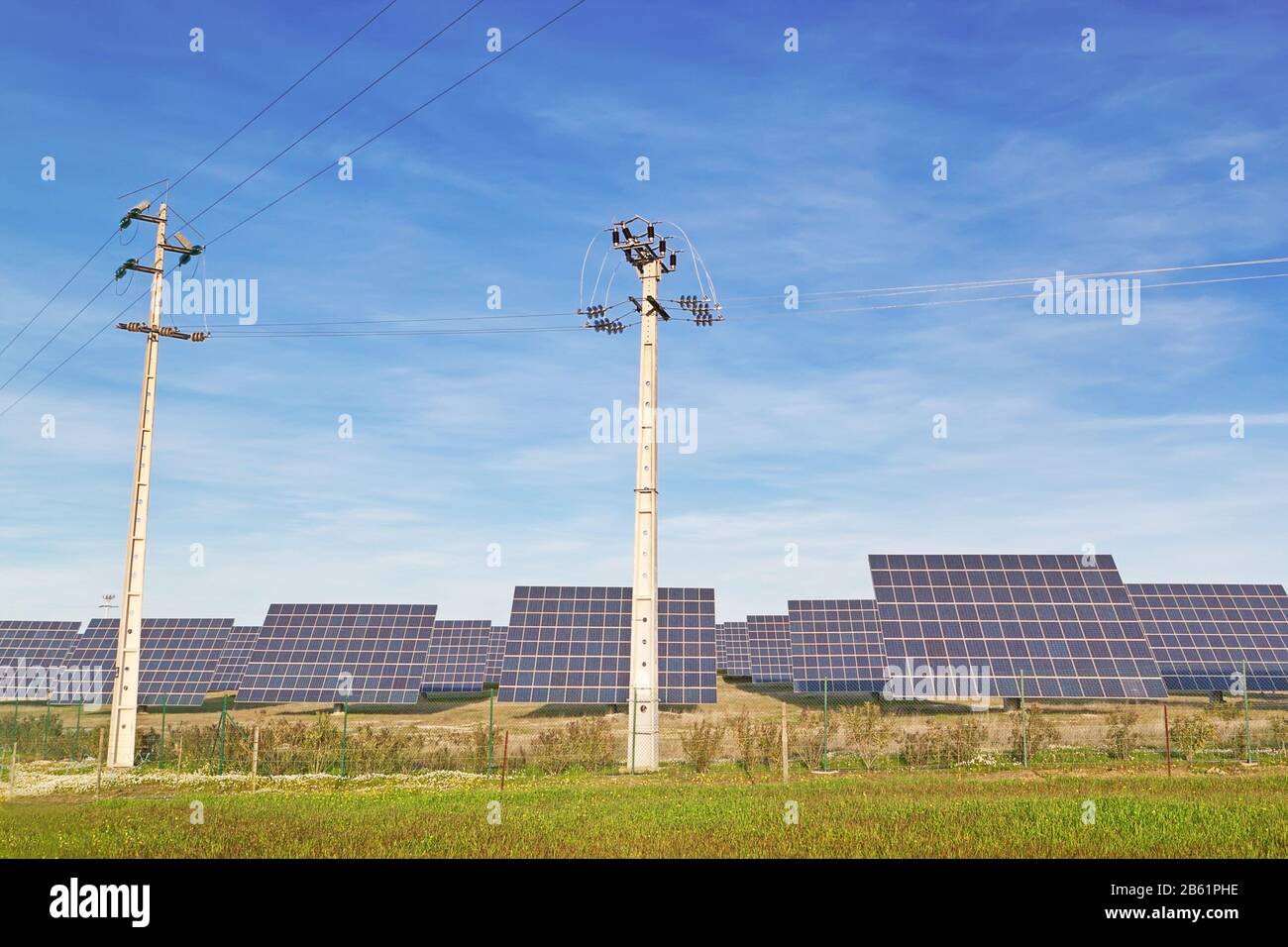 Solar panels and high-voltage line Stock Photo - Alamy
