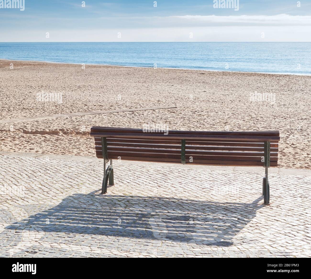 Bench on the beach of the sea. Concept Stock Photo - Alamy