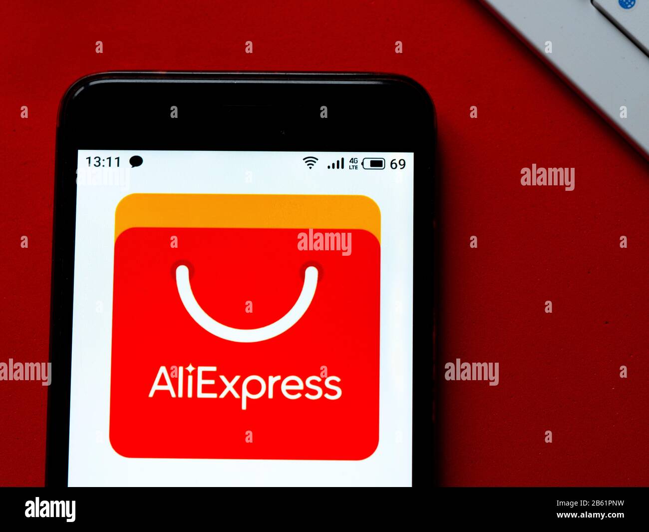 In this photo illustration an AliExpress logo seen displayed on a ...