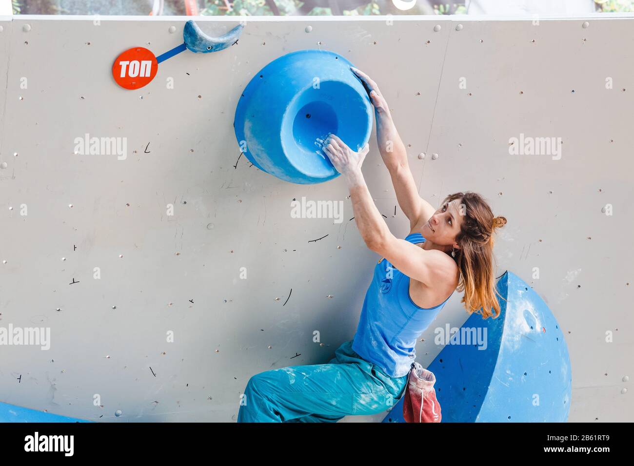 MAY 2017, UFA, RUSSIA: A female climber at open climbing gym shows ...