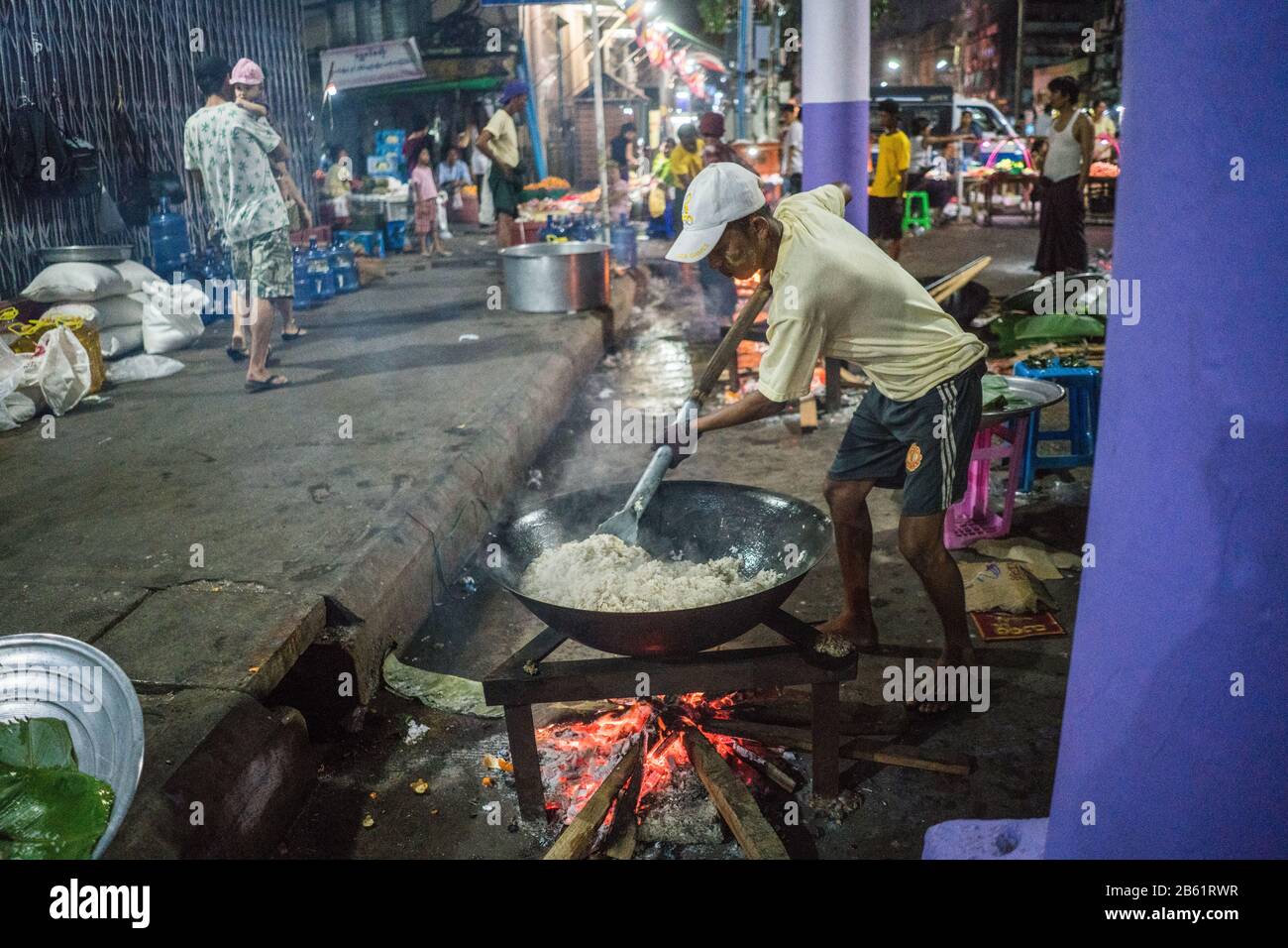 Local men cook food in the street of the Yangon, Myanmar, Asia Stock ...