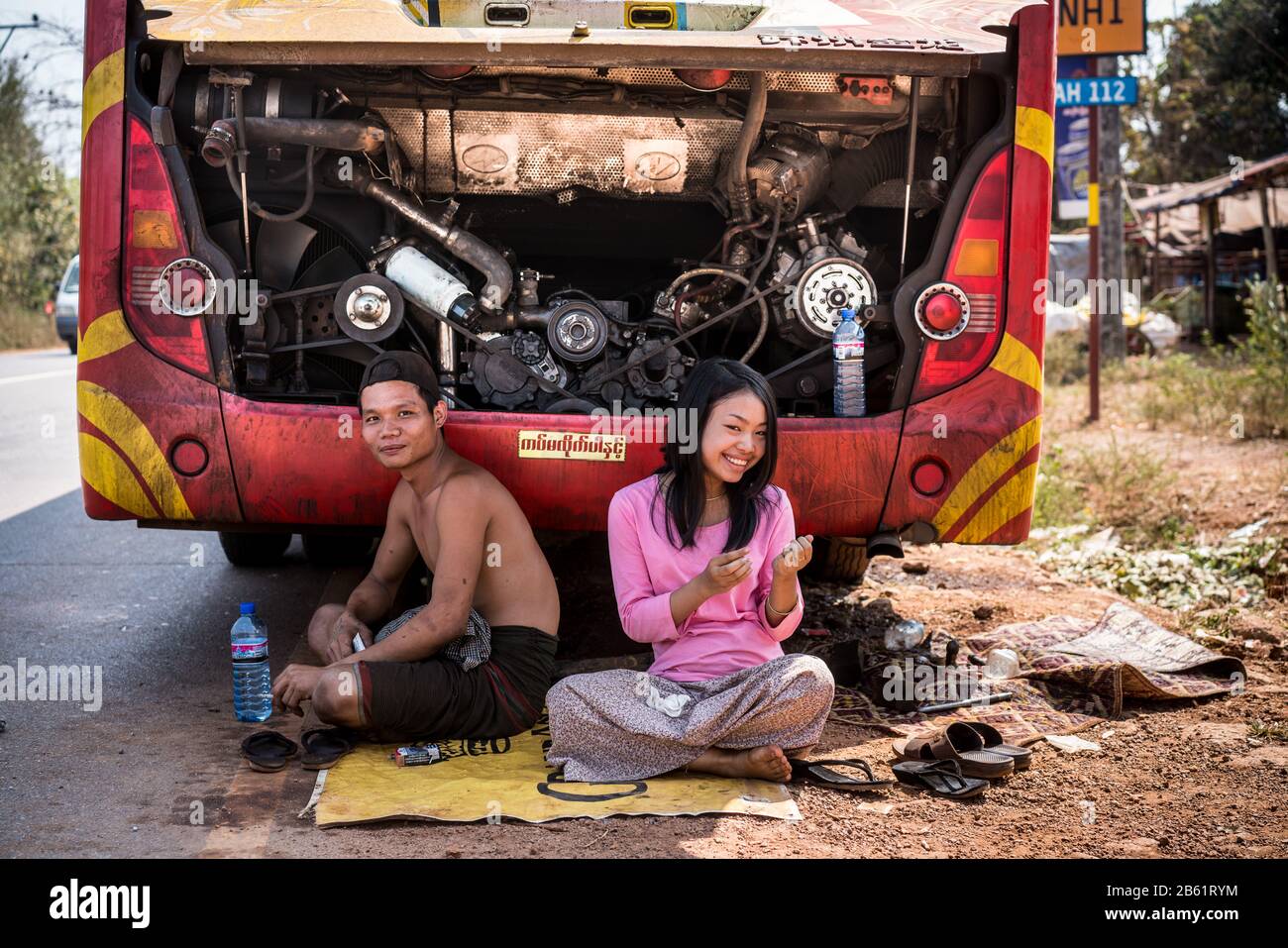 Repair of the broken bus on the road, Myanmar, Asia Stock Photo - Alamy